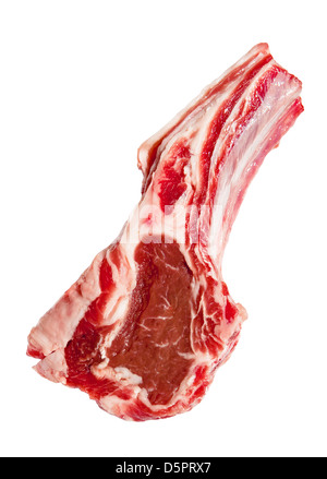 Lamb mutton chop steak, raw meat cutlet in a skillet with herbs. Black ...