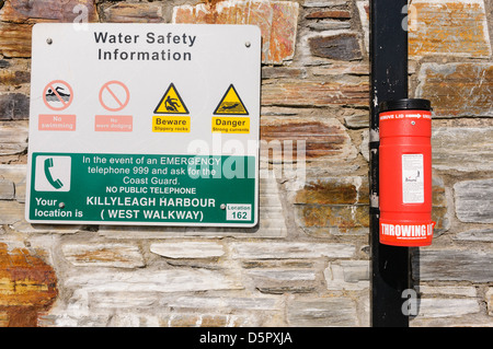 Emergency throwing line on a harbour wall Stock Photo - Alamy