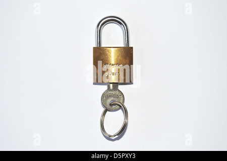 A locked Zenith padlock and key photographed in a studio Stock Photo ...