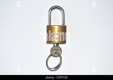 A locked Zenith padlock and key photographed in a studio Stock Photo ...