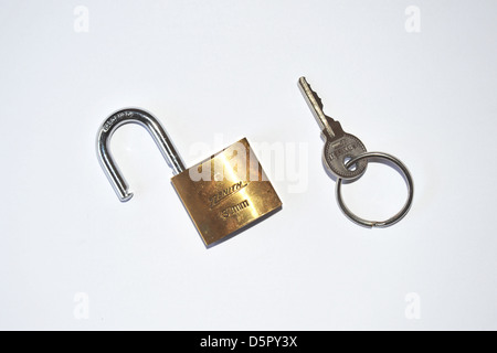 An unlocked Zenith padlock with key photographed in a studio Stock ...