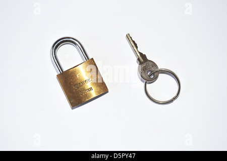 A locked Zenith padlock and key photographed in a studio Stock Photo ...