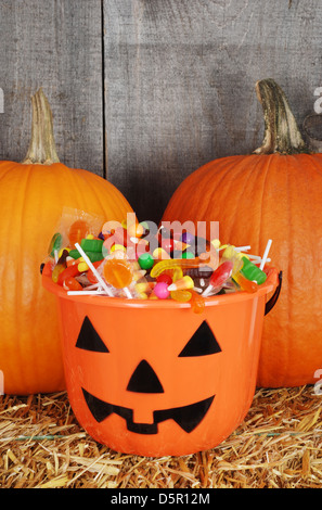 Bucket filled with halloween candy Stock Photo - Alamy