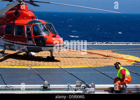 helicopter landed in the landing deck of seismic vessel Ramform ...