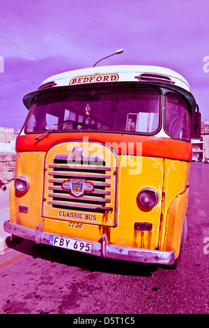Local iconic yellow bus, Malta Stock Photo - Alamy