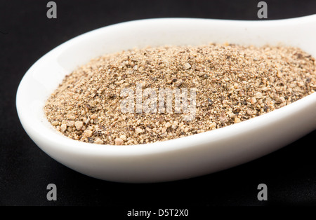 White ground pepper and whole peppercorn spice isolated on white ...