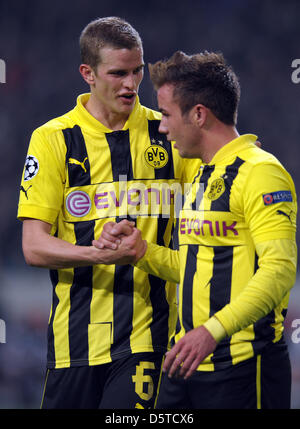 Dortmund's Sven Bender (L-R), Mario Goetze, scorer Shinji Kagawa and ...