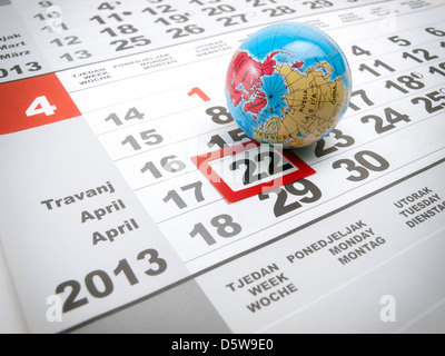 Earth day marked on the calendar on blue background Stock Photo - Alamy