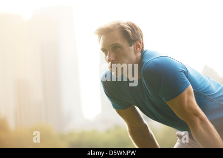 Muscular young man leaning back Stock Photo - Alamy