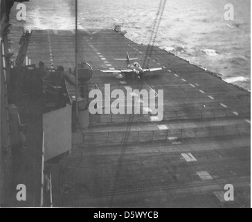 A Grumman F9F-8 on the flight deck of the USS Intrepid aircraft carrier ...