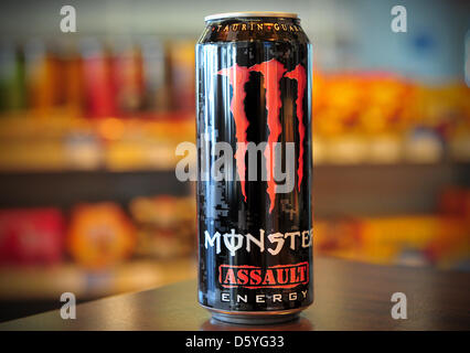 Monster Energy drink on table against a green background Stock Photo ...