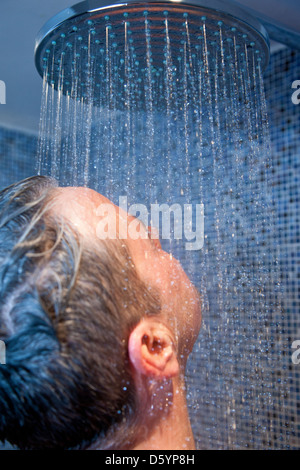 Close-up of a man taking a shower Stock Photo - Alamy