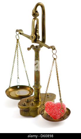 Heart and money on balance scale - Order of priority in life among love ...