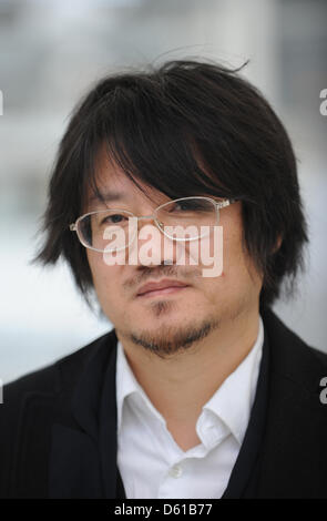 Documenta artist Yan Lei stands in front of his paintings at the ...