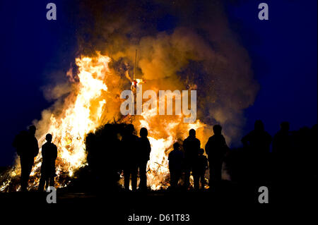 A symbolic witch is burnt in a bonfire during the Walpurgisnacht ...