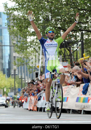 Italy's Moreno Moser (C) from team Liquigas-Cannondale celebrates first ...
