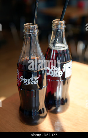 Coca cola bottle with a straw Stock Photo - Alamy