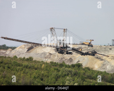 This image shows a bucket wheel excavator operating in winter conditions, highlighting the ...