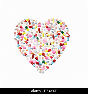 heart shape pill Stock Photo - Alamy