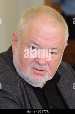 A court bailiff shows hotelier Axel Hilpert his place in a courtroom in ...