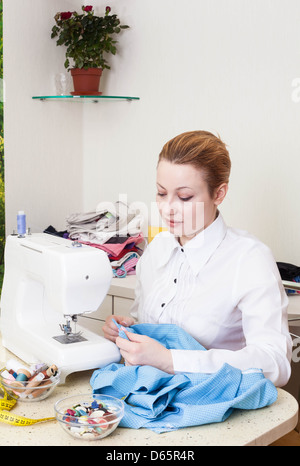 A sewer altering a garment Stock Photo - Alamy