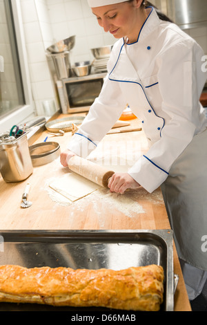smiling female chef or baker with rolling pin Stock Photo - Alamy