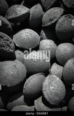 Briquettes from olive stones sit in a grill in Bodenheim, Germany, 07 ...
