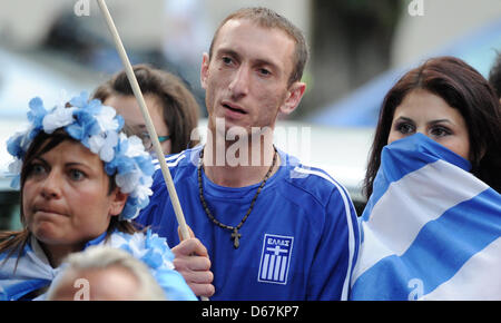 Greek soccer fans watch the UEFA EURO 2012 quarter final soccer match ...