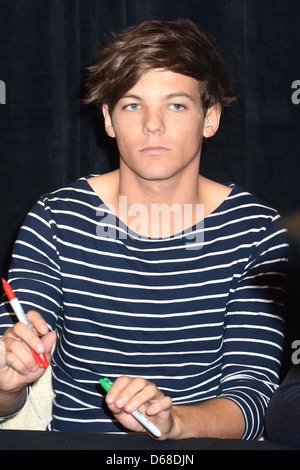 Louis Tomlinson of One Direction at a signing of their book, 'One ...