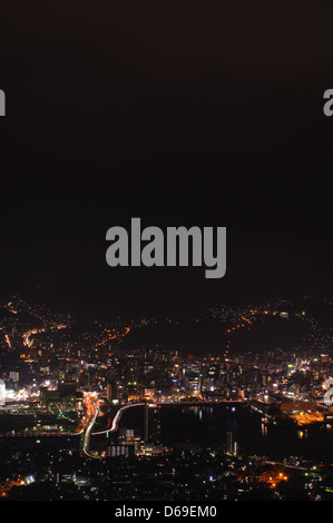 A nighttime photo of Inasayama in Nagasaki, Japan. The image shows the ...