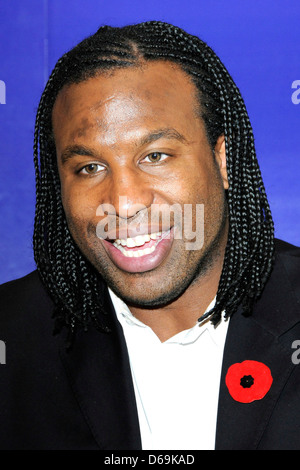 Former NHL player, Georges Laraque, signs his latest book 'The Story of ...