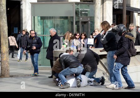 French undercover police arresting pickpockets on The Champs-Elysees ...