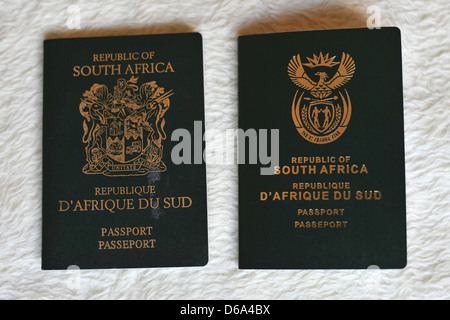 An example of an old South African passport next to a new South African ...