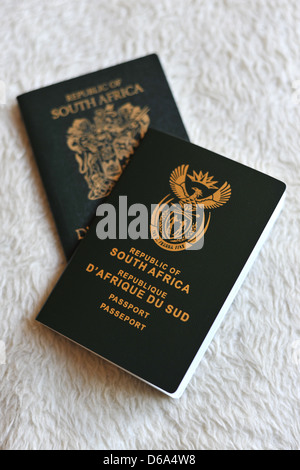 A new South African passport next to a South African Identity Document ...