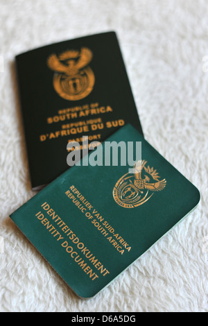 A new South African passport next to a South African Identity Document ...