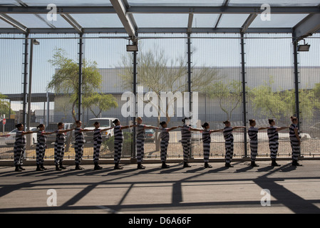 Inmates of the female chain gang line up ready to enter Estrella Jail ...