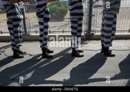Inmates of the female chain gang line up ready to enter Estrella Jail ...
