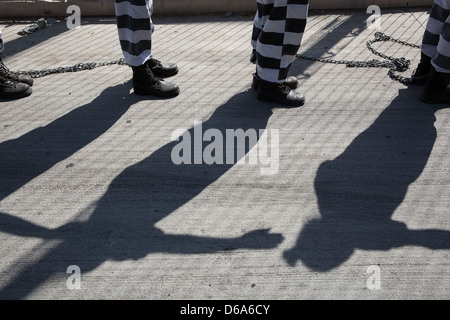 Inmates of the female chain gang line up ready to enter Estrella Jail ...