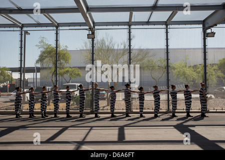 Inmates of the female chain gang line up ready to enter Estrella Jail ...
