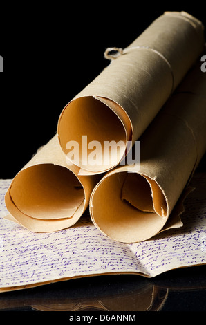 Many scrolls on black background Stock Photo - Alamy