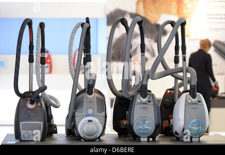 Vacuum cleaners are on display at the booth of German electrical ...