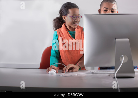 Children using computer together Stock Photo - Alamy