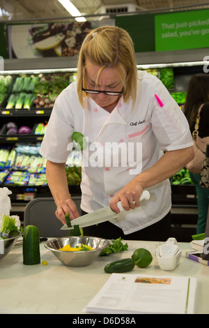 A cooking demonstration in the grocery section of a Walmart store Stock ...