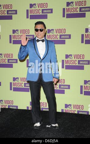 South Korean rapper Psy poses at the MTV Video Music Awards Photo Press ...