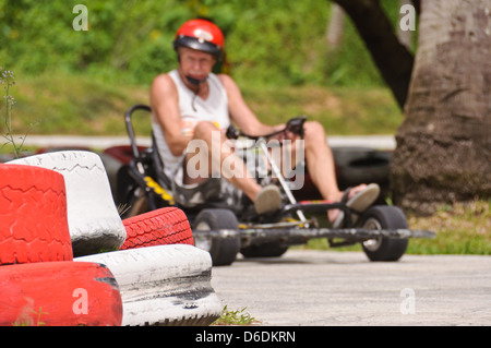 Kart racing, karting – Elderly Caucasian man and woman racing karts, go ...