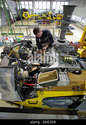 Aircraft mechanic Michael Straube maintains an ADAC rescue helicopter ...