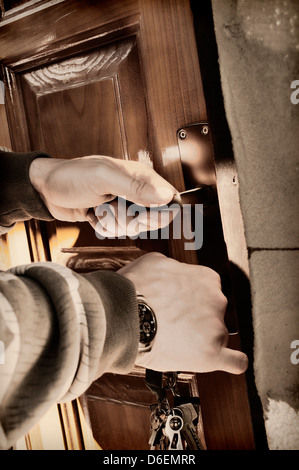 Unlocking the door Stock Photo: 310043926 - Alamy