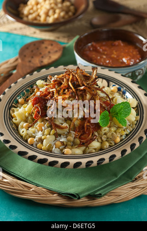 Egyptian cuisine of Koshary, a popular street food made of rice ...