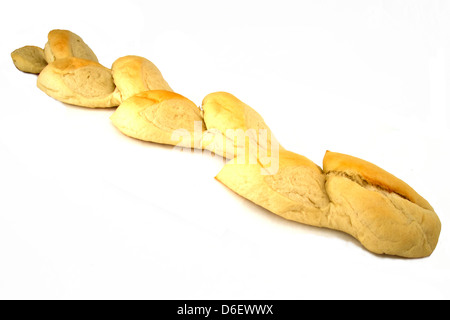 Fresh baked French pain d'epi or wheat stalk bread on white background ...