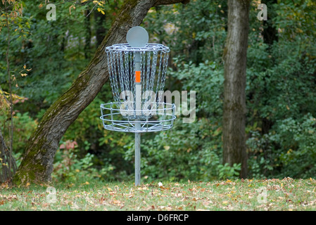 Disc golf scoring basket or pole hole on a snow covered course with ...